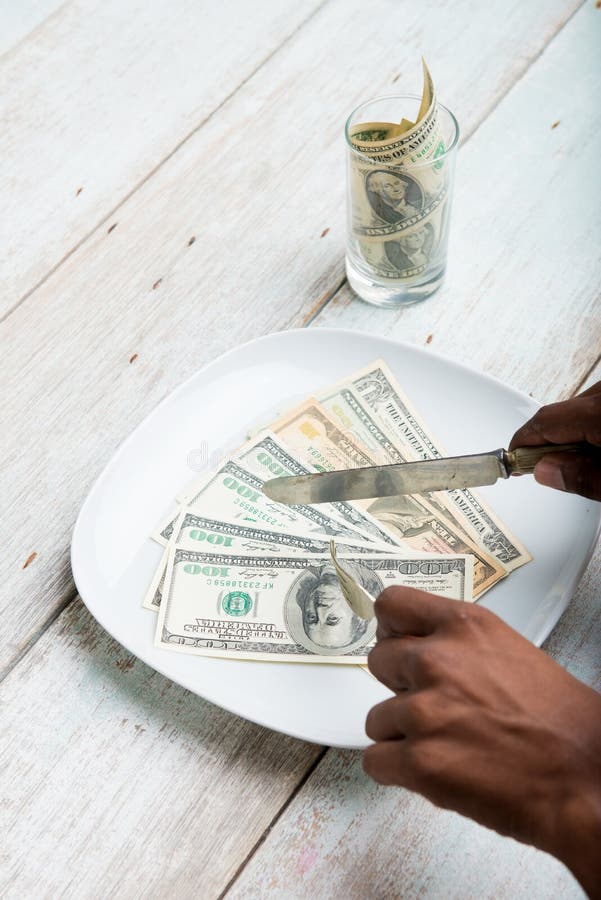 Hand Eating Banknotes Symbolising Consumerism Stock Image - Image of ...