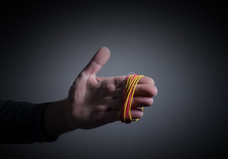 Hand with elastic rubbers stock image. Image of supply - 143836867