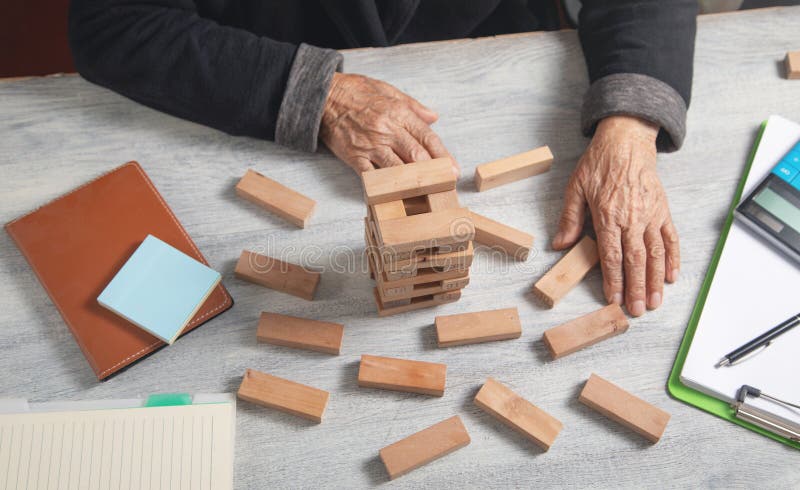 Hand of Elderly Woman Stacking Wooden Blocks Stock Image - Image of ...