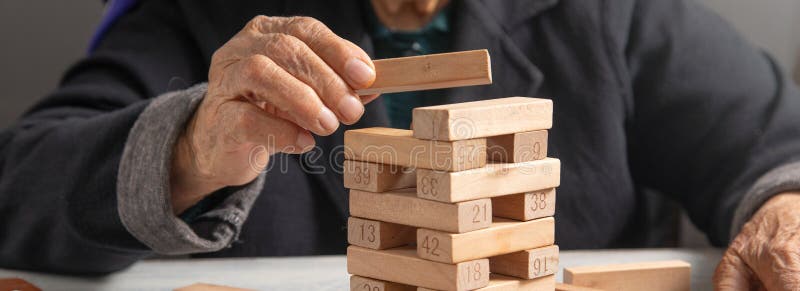 Hand of Elderly Woman Stacking Wooden Blocks Stock Image - Image of ...