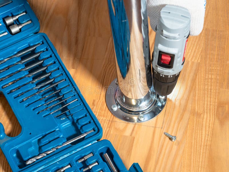 Hand with Electric Screwdriver Fixes Table Support Stock Image - Image ...