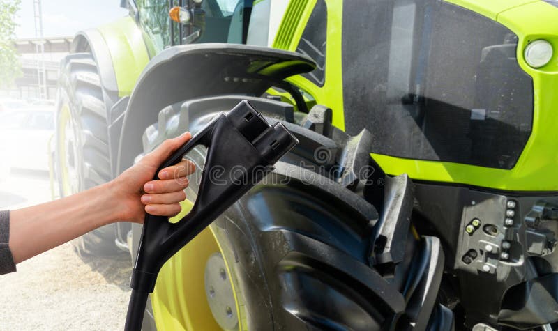Hand with Electric Vehicles Charging Plug on a Background of ...