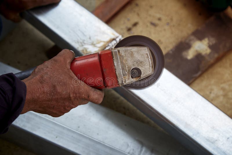 Hand Electric Wheel Grinding on Steel Stock Photo - Image of steel ...