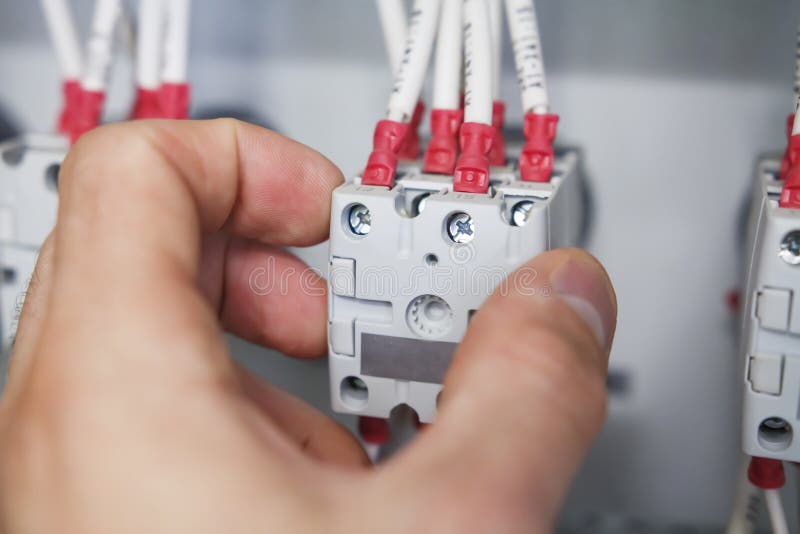 Hand of Electrician Installs Package Switch with Connected Wires in ...