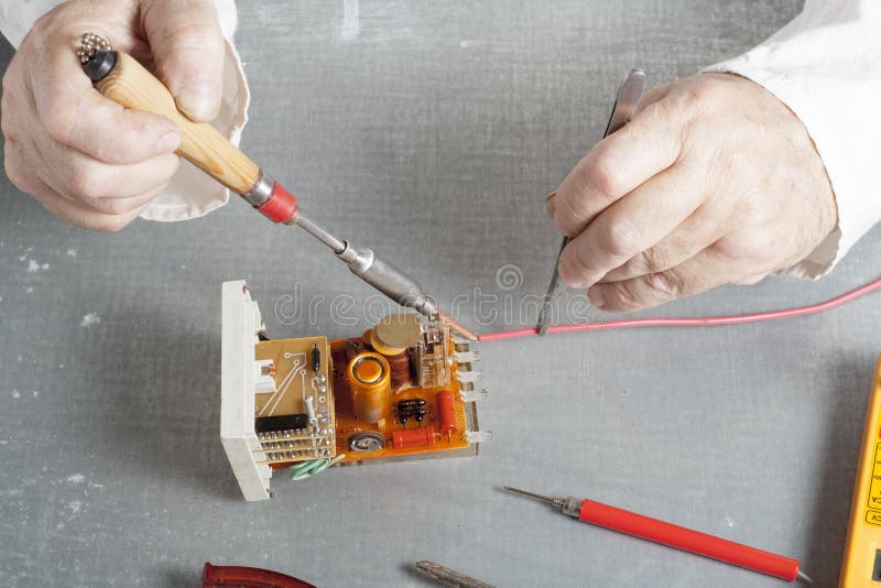 Hand of Electrician with Multimeter Probe at Electrical Switchgear ...
