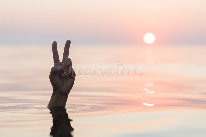 Gesture Of Victory Or Hand Of Peace In A Sunset Stock Photo - Image of ...