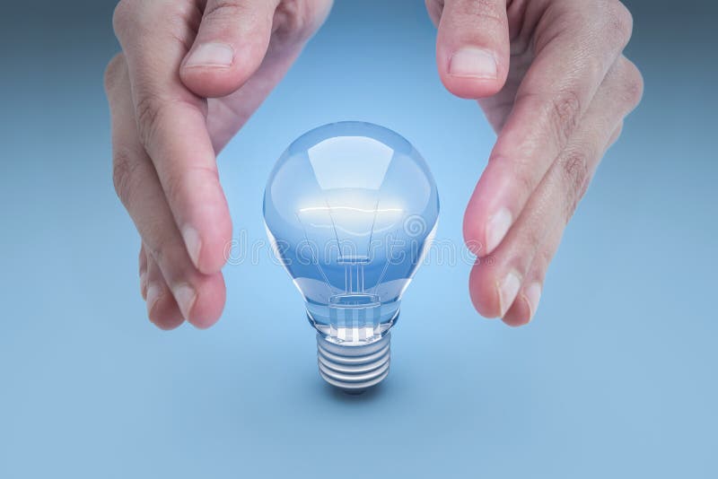 Hand and Energy Saving Lamp on a Blue Background Stock Photo - Image of ...