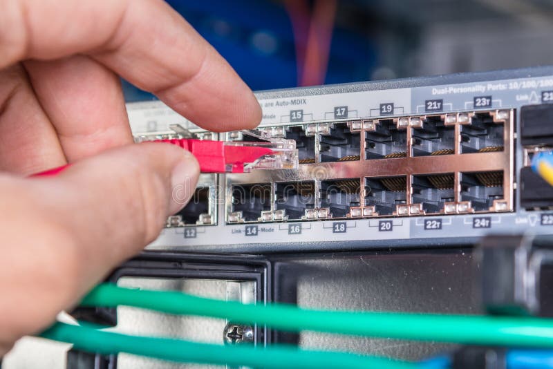 Hand of Engineer Plugging in Ethernet Cable into Server Switch P Stock ...