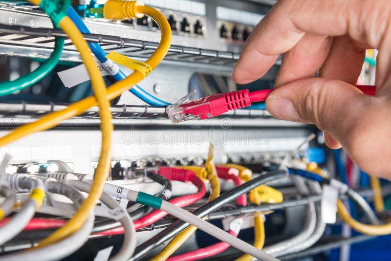 Hand of Engineer Plugging in Ethernet Cable into Server Switch P Stock ...