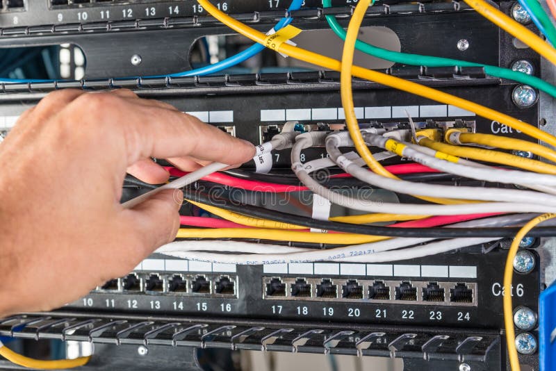 Hand of Engineer Plugging in Ethernet Cable into Server Switch P Stock ...
