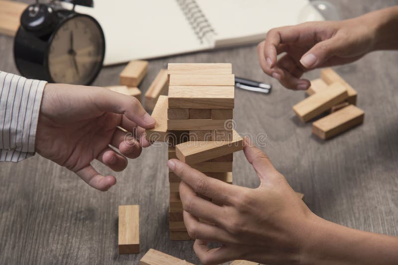 Hand of Engineer Point a Blocks Wood Tower Game. Concept Prevent Stock ...