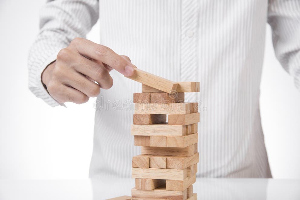 Hand of Engineer Point a Blocks Wood Tower Game. Stock Photo - Image of ...