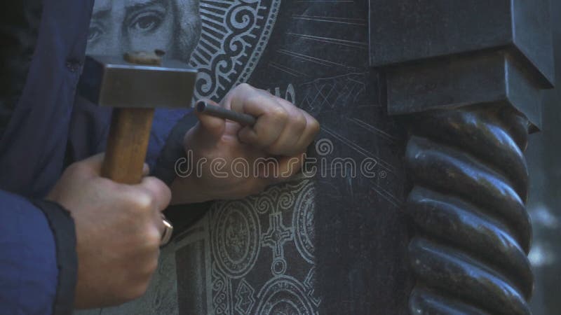 Hand engraving on stone stock footage. Video of closeup - 129593290