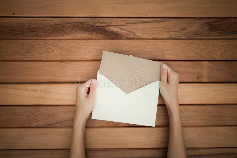 Hand with Envelope on a Wooden Table. Stock Image - Image of vintage ...