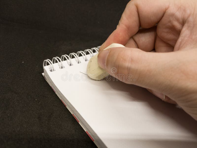 Erasing on paper close up stock photo. Image of close - 252786864