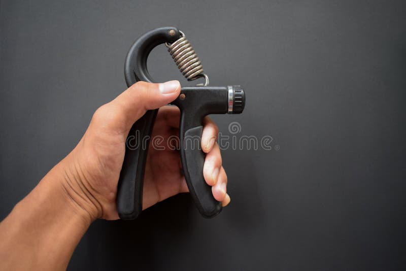 Hand Exercising, Squeezing a Handgrip Stock Image - Image of lifestyle ...