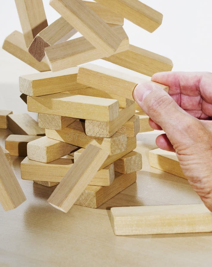Hand with Falling Building Blocks Stock Photo - Image of effect ...