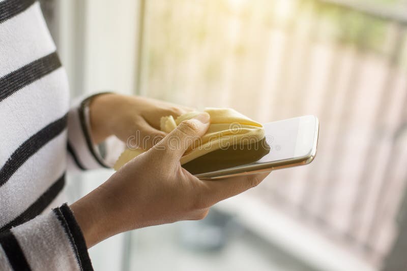 Hand Female Cleaning Her Mobilephone on Screen with Microfiber Stock ...