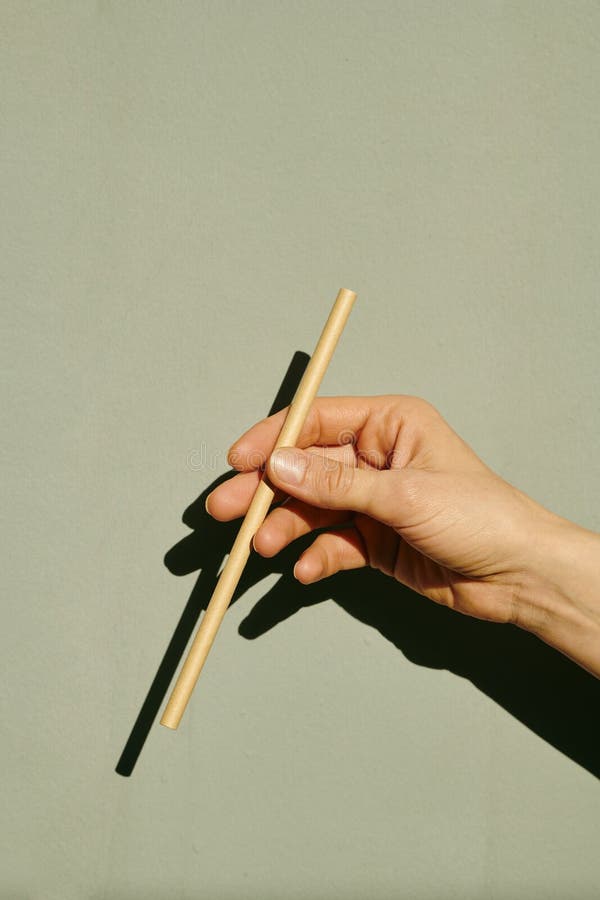 Hand of Female Holding Stick in Front of Camera Stock Image - Image of ...