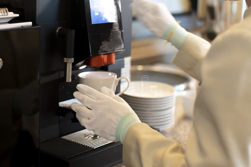 Hand of a Female Hotel Staff at Automatic Coffee Service in the Hotel ...