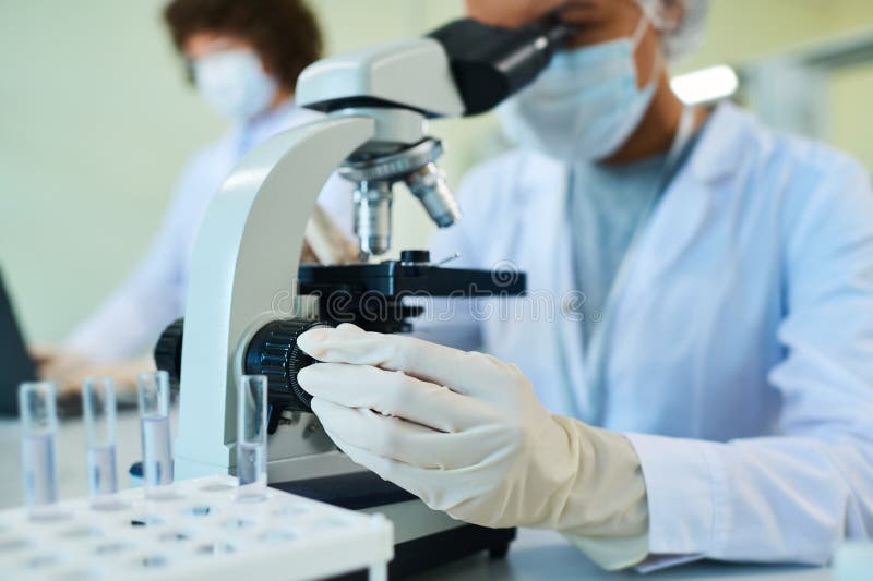 Hand of Female Scientist in Protective Gloves Adjusting Dial on ...
