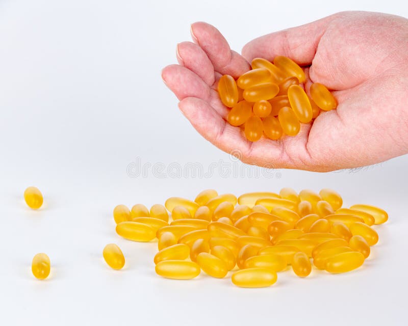 Hand Filled with Gel Vitamins Spilling Stock Image - Image of health ...