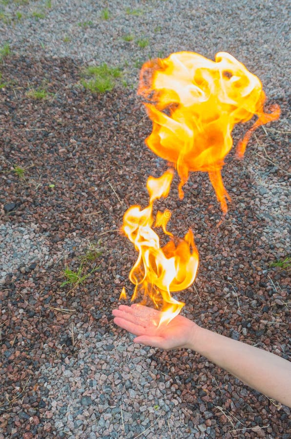 A Man& X27;s Hand Burns With A Bright Flame. Stock Image - Image of ...