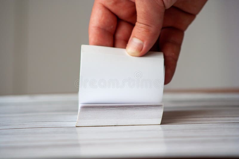 A Hand Flipping through a Blank Notepad, Symbolizing Creativity and ...