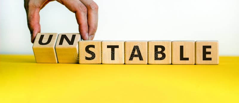 The Word Unstable Changed To Stable on Torn Paper Stock Photo - Image ...