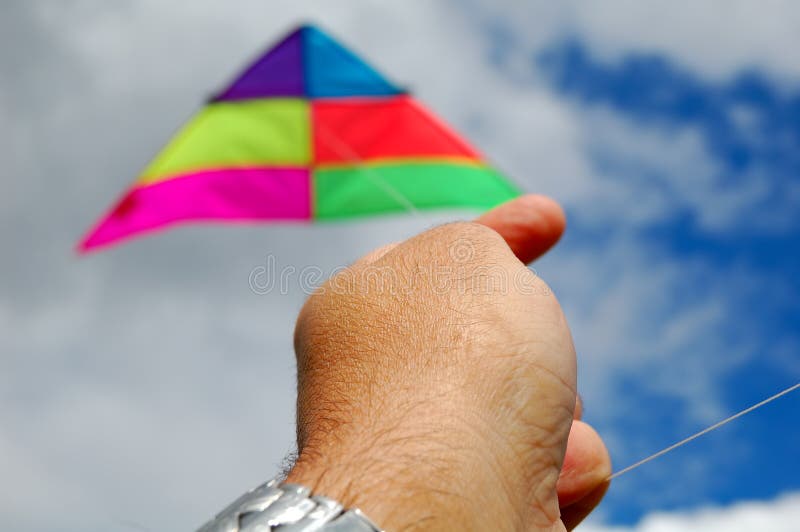 Hand flying a kite stock image. Image of scenic, rich - 5758537