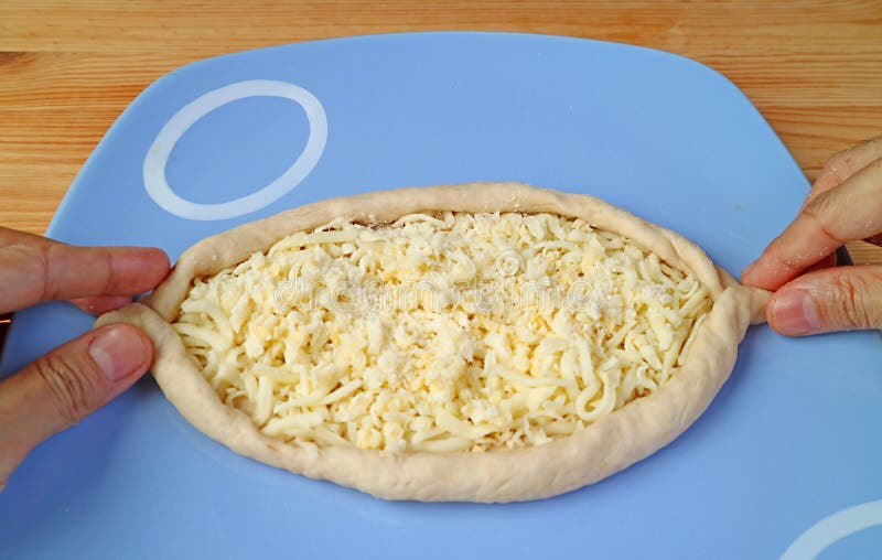 Hand Folding the Edge of the Dough for Baking Khachapuri, the Georgian ...