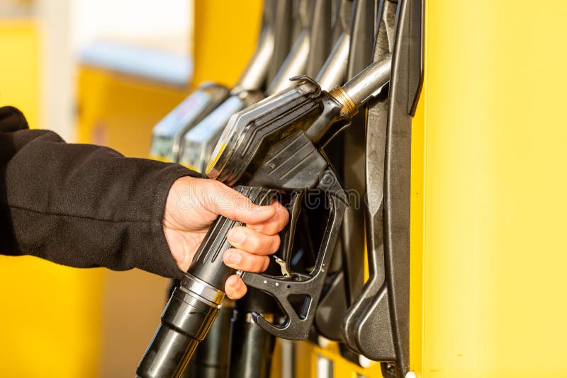 Hand with fuel nozzle stock image. Image of refuel, friendly - 154885703