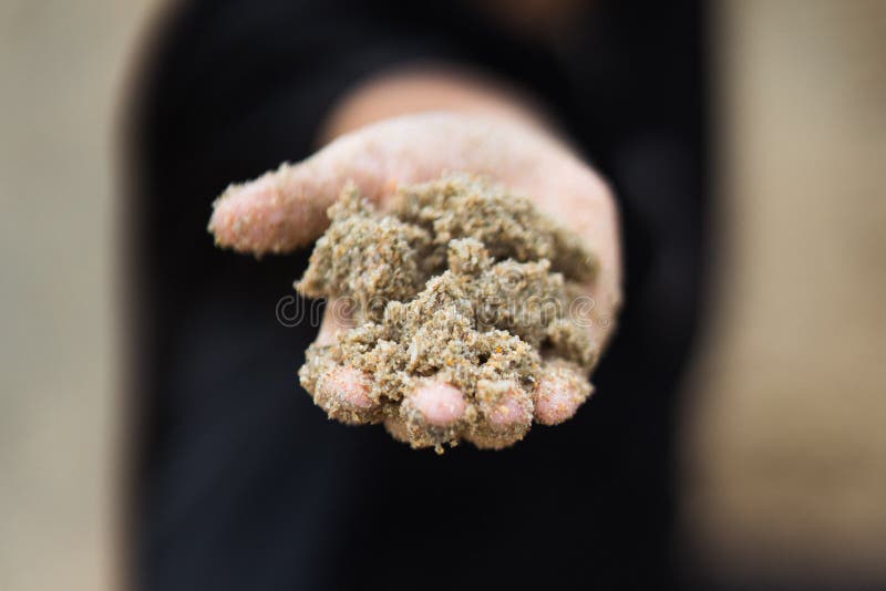 A hand full of sand stock photo. Image of summer, closeup - 160297436