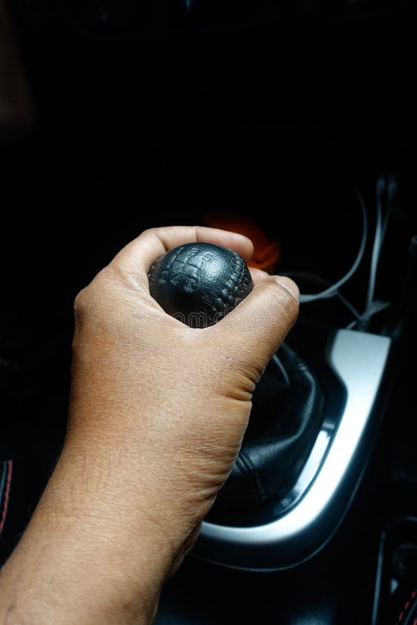 Hand on gear shift knob. stock photo. Image of limb - 264752562