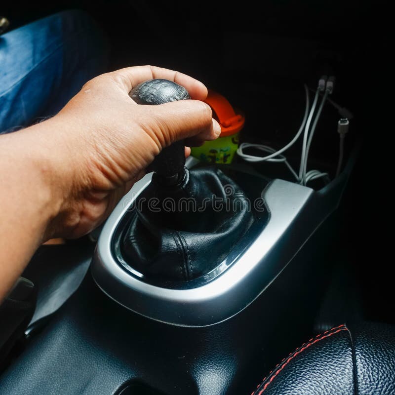 Hand on gear shift knob. stock photo. Image of design - 264752570