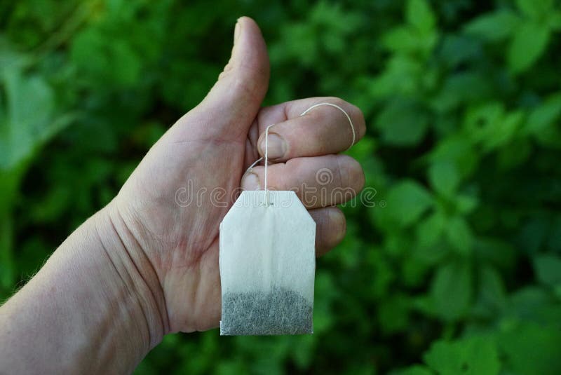 Hand in a Gesture of Approval with a Paper Tea Bag Stock Image - Image ...