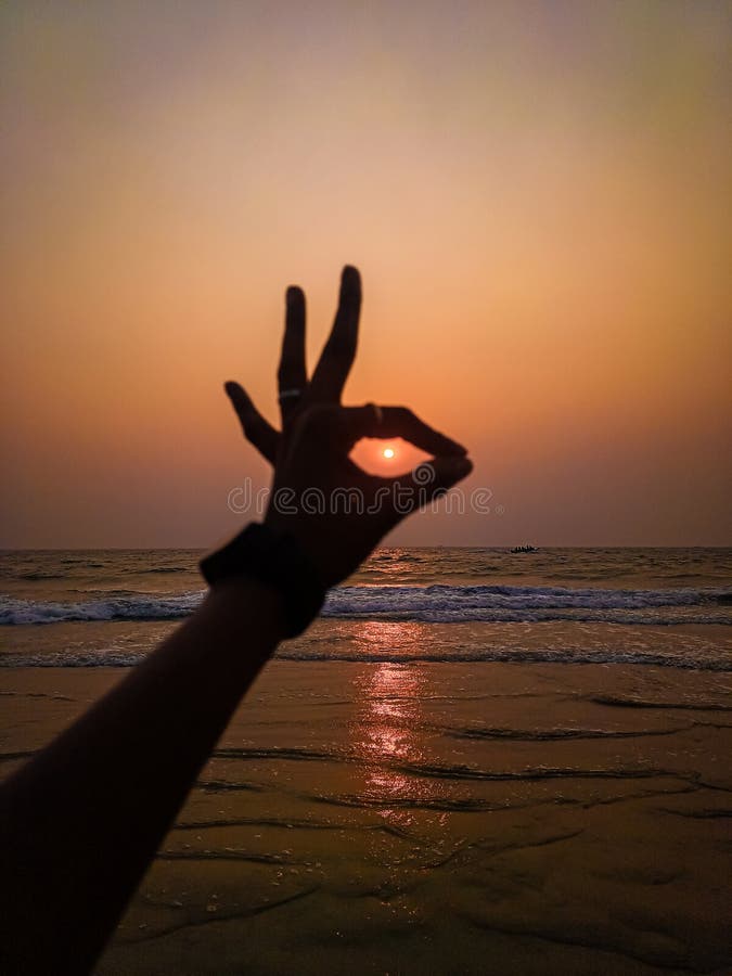 Hand Gesture at the Sunset Time at the Beach Stock Photo - Image of ...