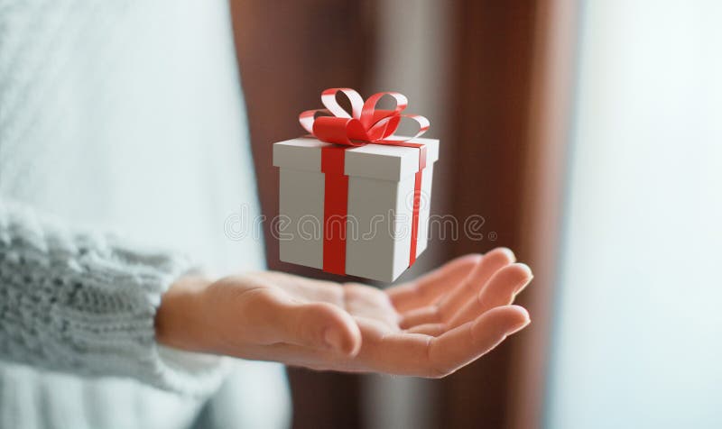Hand with Gift Box with Red Ribbon for Christmas Stock Photo - Image of ...