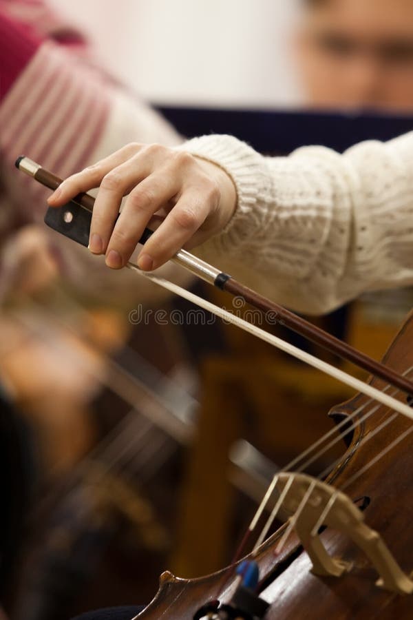 Hand girl playing cello stock image. Image of classical - 64698655