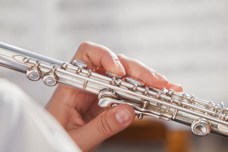Hand girl playing flute stock image. Image of clasical - 55940603