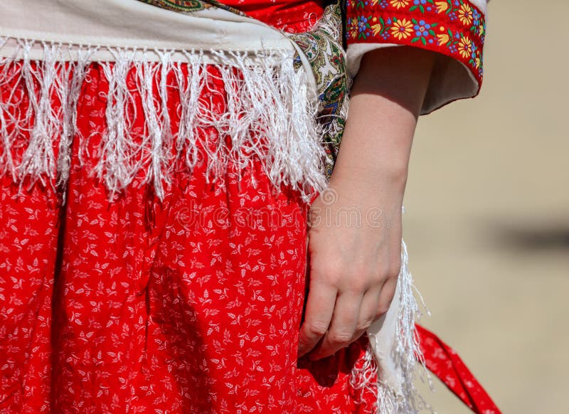 The Hand of a Girl Standing in a Red Dress Stock Image - Image of heels ...