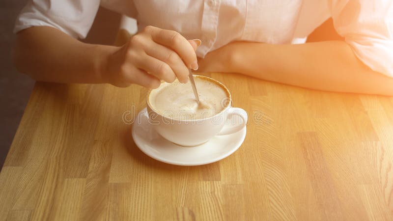 Hand of Girl Stiring Sugar in Coffee Close Up Stock Photo - Image of ...