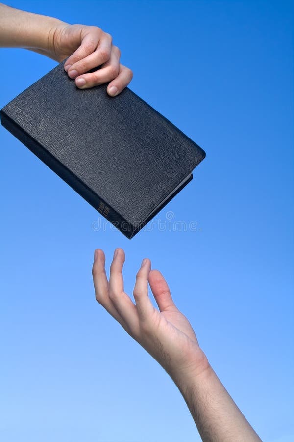 Hand Giving the Bible stock photo. Image of close, caucasian - 23963172