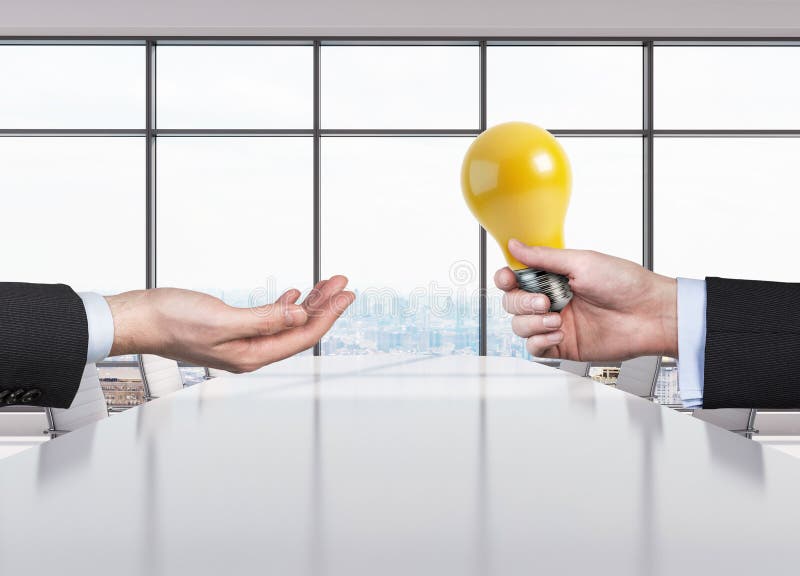 Hand giving bulb stock photo. Image of electric, close - 50440872