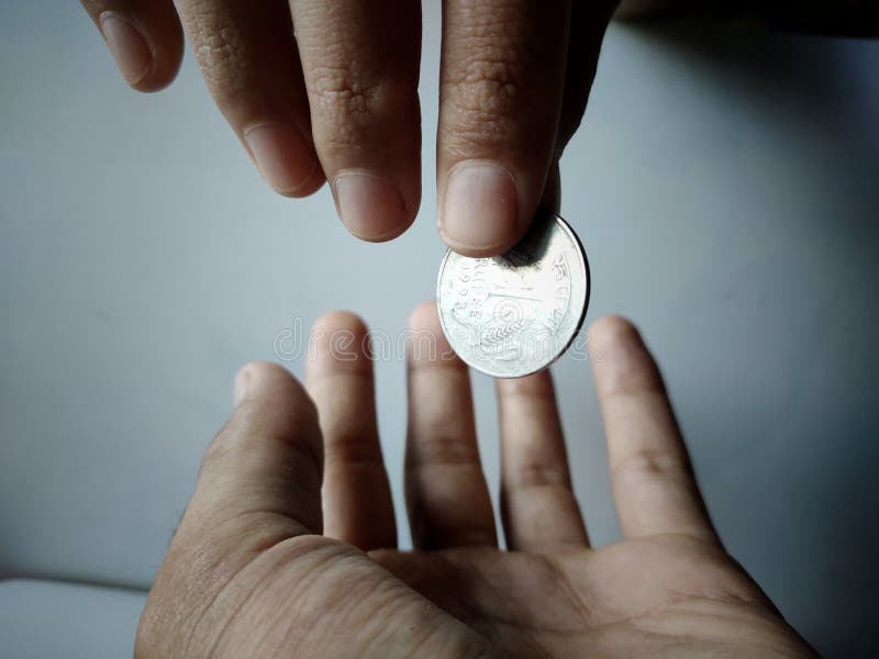 Hand giving coin stock photo. Image of bill, coin, loan - 22505358