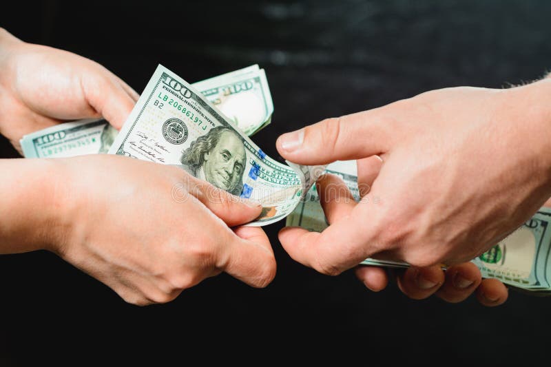 The Hand, Giving Money, is Isolated on a Black Background Stock Image ...