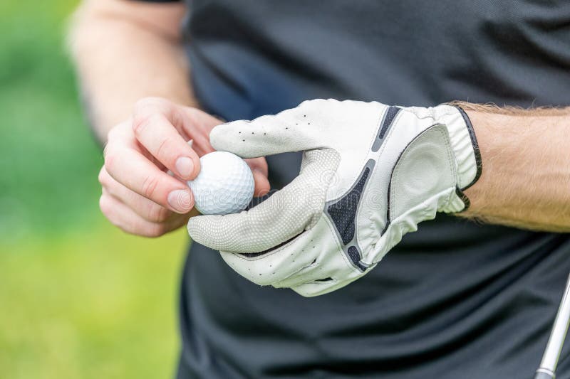 Hand in Glove Holding Golf Ball Stock Image - Image of grip, club ...