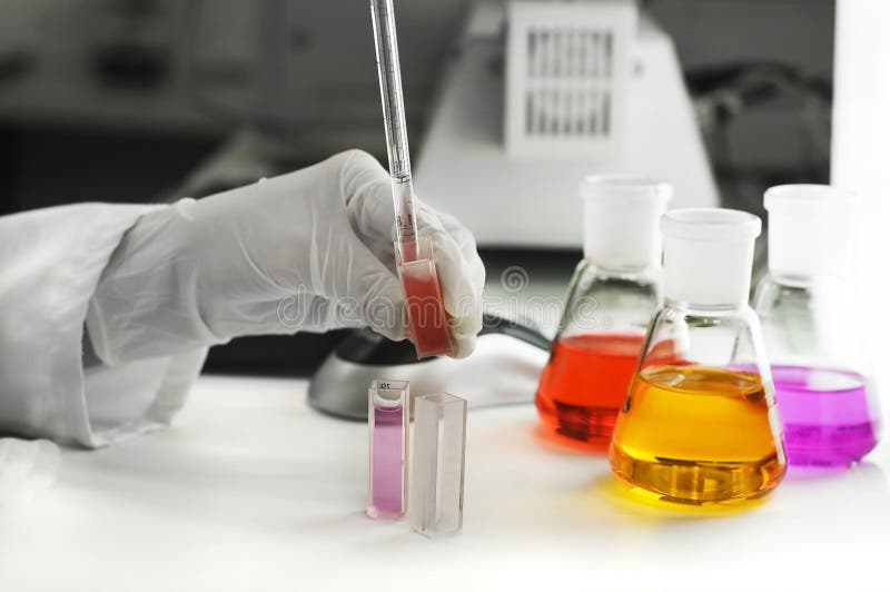 Hand in Glove with Laboratory Flasks Stock Image - Image of ...
