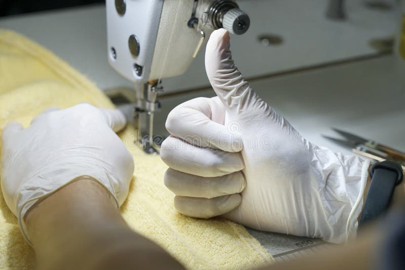 Hand in a Glove Near a Sewing Machine Stock Photo - Image of ...