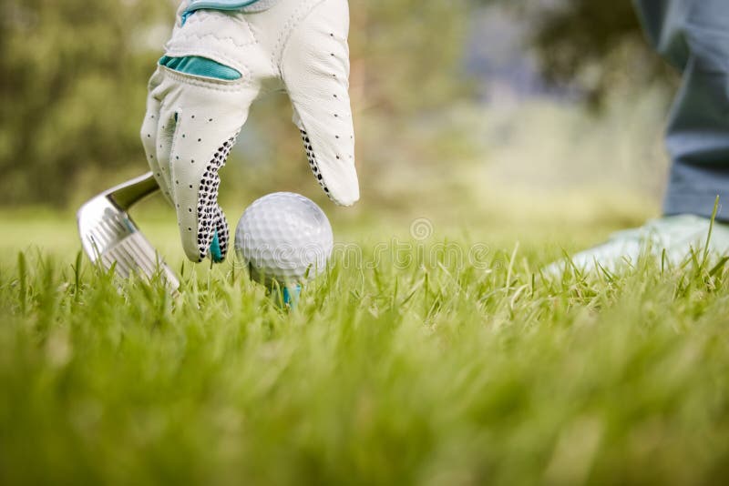 Hand in Glove Placing Golf Ball on Tee Stock Image - Image of glove ...